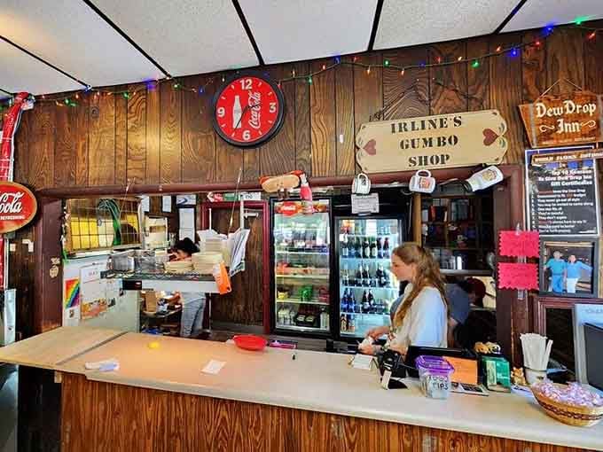 The counter at the Dew Drop Inn, where Irline's Gumbo Shop sign reminds you there's always more to discover.