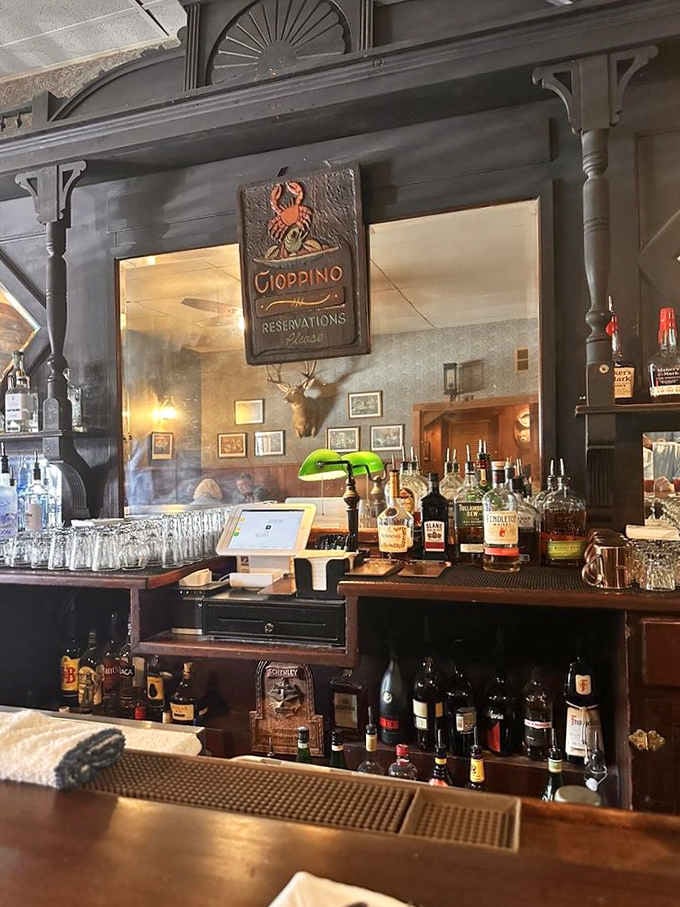 That ornate dark bar with the cioppino reservations sign overhead is the kind of detail you photograph immediately.