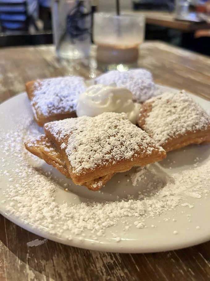 Beignets dusted with enough powdered sugar to create your own personal snowstorm, just like the French Quarter intended.