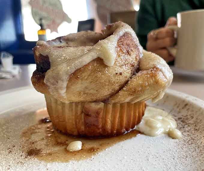 This cinnamon roll looks like it's been touched by angels and dusted with powdered sugar from heaven itself.