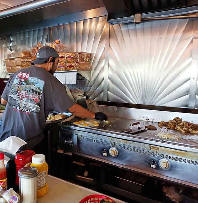 The griddle doesn't lie. Eggs, home fries, and pure focused energy, all happening at once right here.