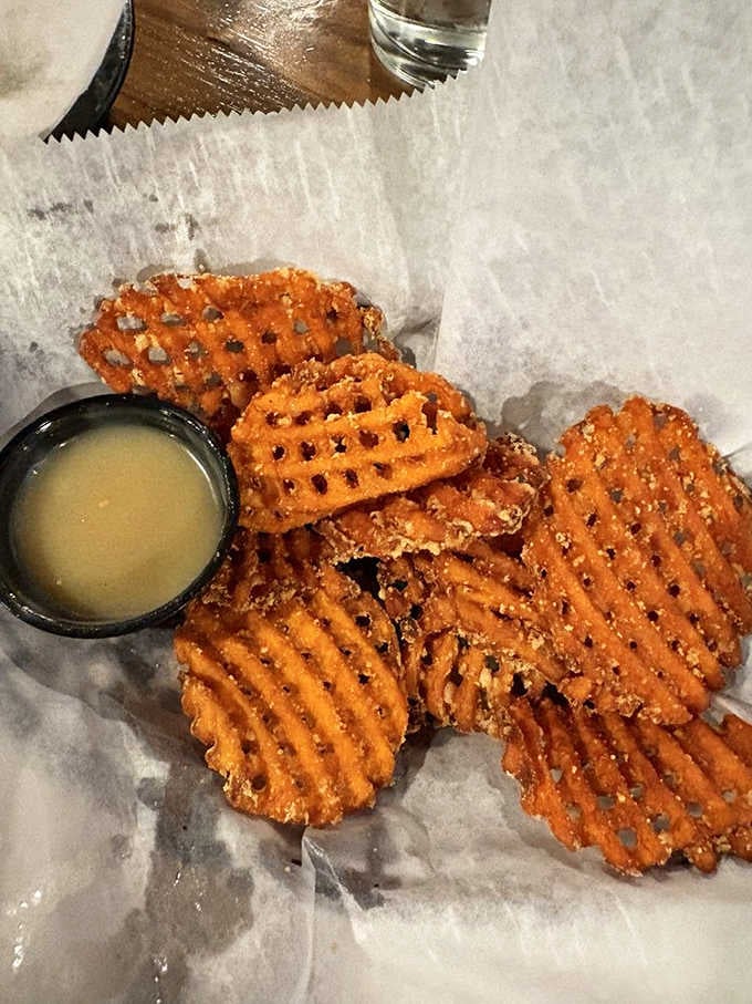 Sweet potato waffle fries with a honey dipping sauce. Crispy, golden, and dangerously easy to finish before your meal arrives.