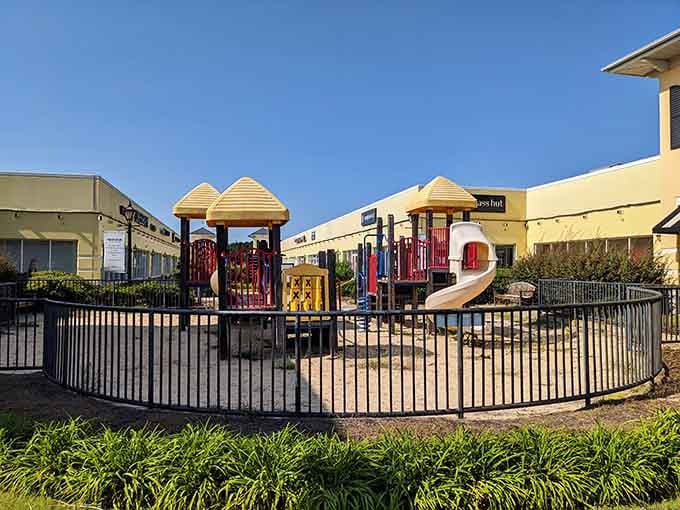 A playground where exhausted shopping partners can deposit energetic children while they recover from browsing fatigue and regroup.