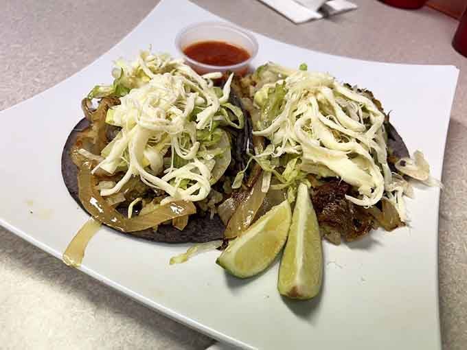 These papazules on dark blue corn tortillas with saut&eacute;ed onions and nopales are a quiet revelation on a plate.