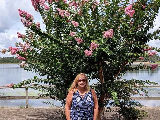 Standing beneath a blooming crape myrtle with the lake shimmering behind you is basically Georgia's version of a perfect summer portrait.