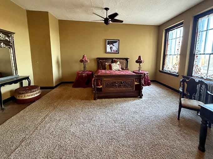 A bedroom preserved from another era, where visitors report unexplained sounds and the distinct feeling of being watched while sleeping.