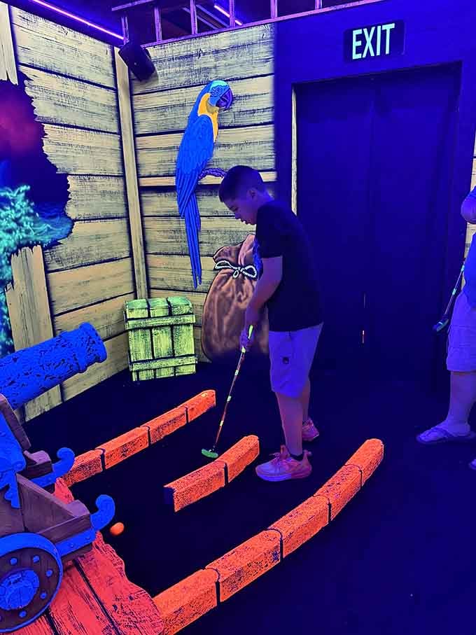 Blacklight mini golf with a parrot watching your every putt, no pressure, but that bird is judging you.