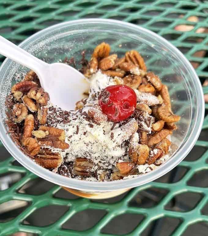 Pecans piled high over custard and hot fudge. The Turtle sundae is a masterclass in topping generosity.