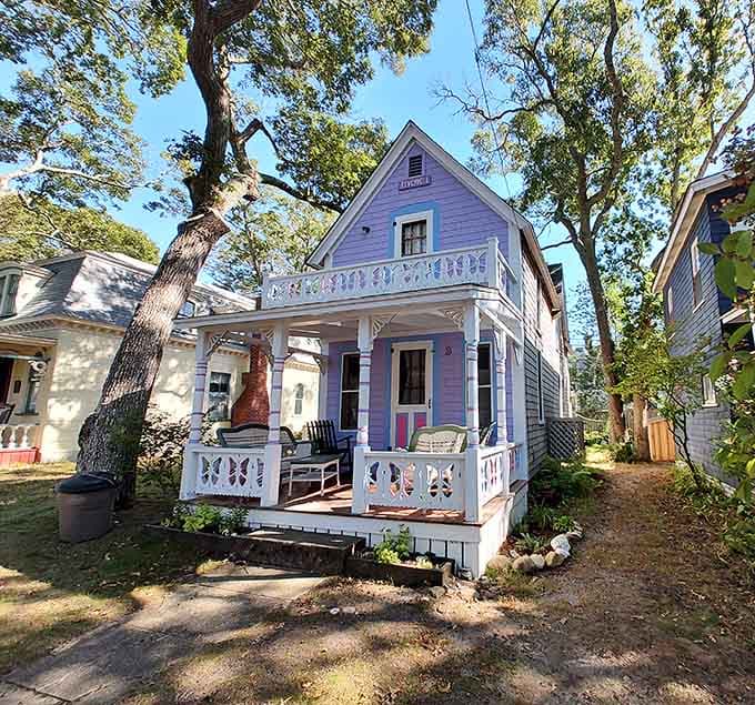 Lavender walls and butterfly cutouts on the railing. This little cottage is pure, unfiltered charm.