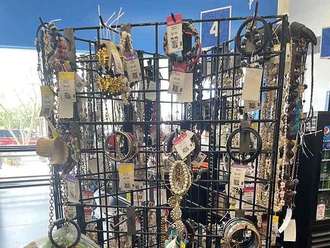 Necklaces, bracelets, and bangles crowd a wire rack, each one waiting for someone to say yes to the accessory.