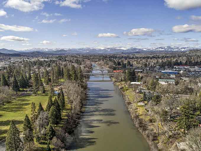 The Rogue River stretches out like nature's own highway, with snow-capped mountains handling the scenery department.