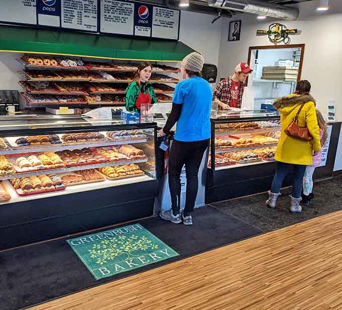 Friendly staff, happy customers, and a glass case full of donuts. This is what a good morning looks like.