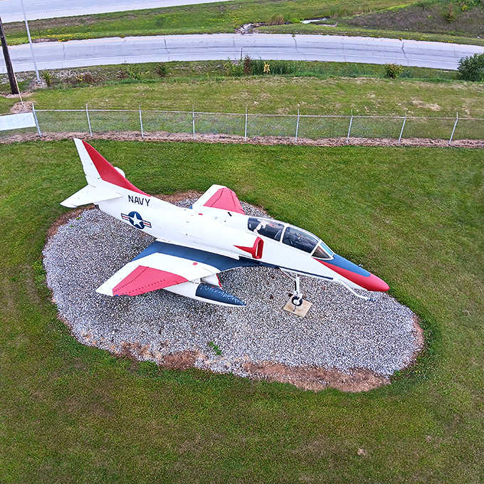 The Navy's Douglas Skyhawk sits pretty in red and white, looking like it's ready for another mission.