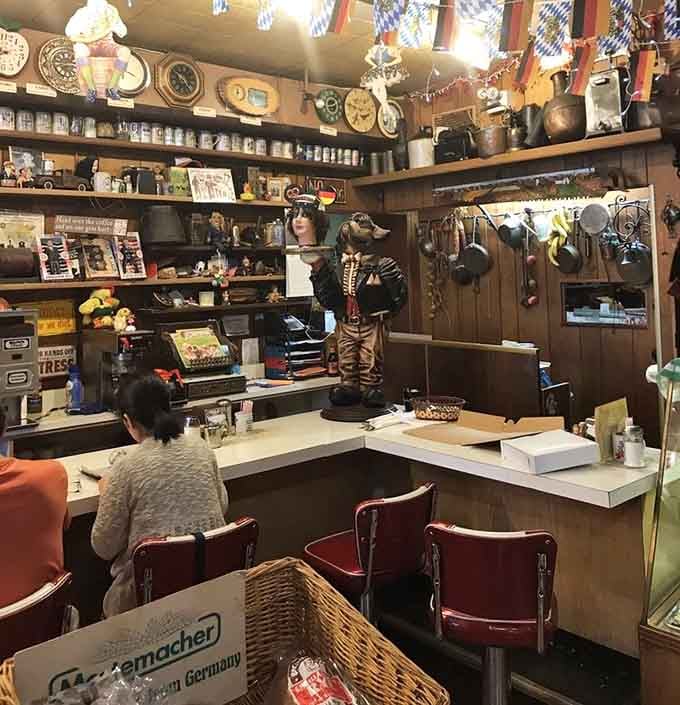 Behind the counter, shelves of German steins and collectibles remind you this place runs on genuine passion.