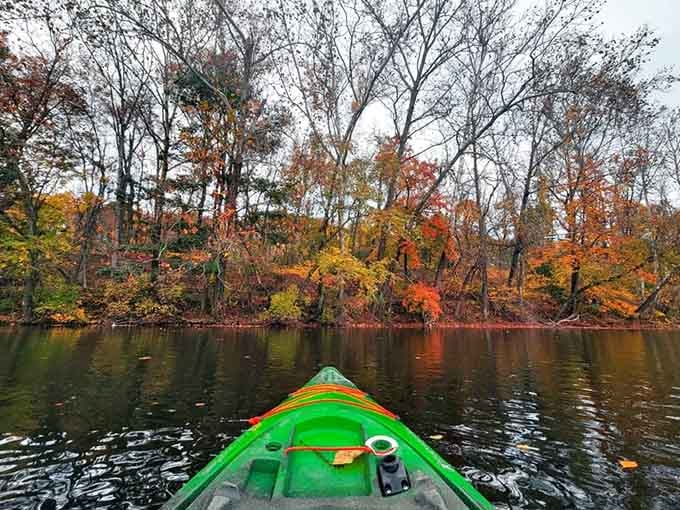 Autumn kayaking means paddling through reflections of red, orange, and gold that no painter could quite capture accurately.