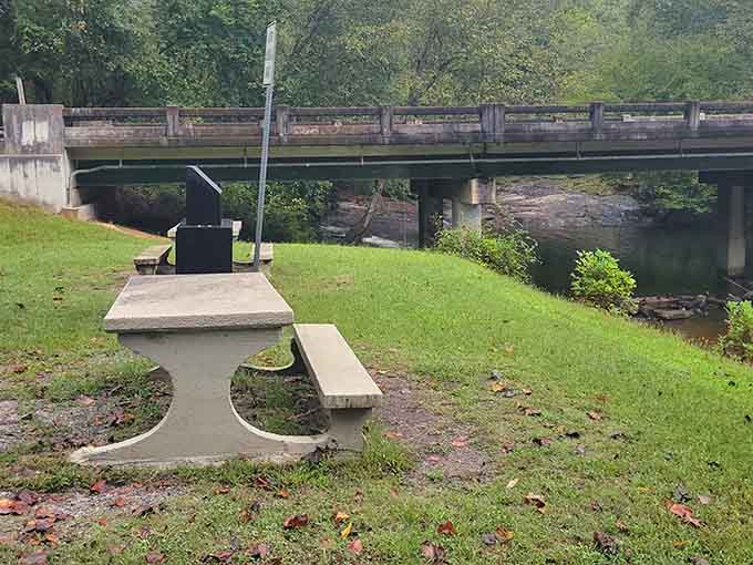 A concrete picnic table, a quiet creek, and zero cell service. This is the original version of unplugging.