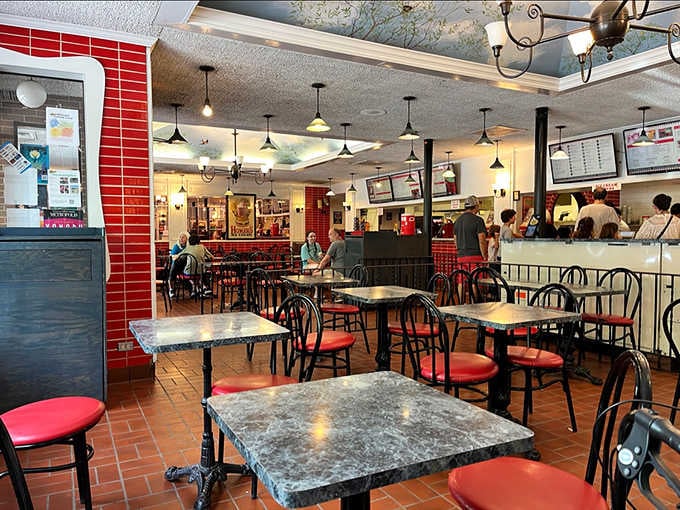 Red tiles, marble tables, and that famous painted ceiling. Homer's dining room has a personality all its own.