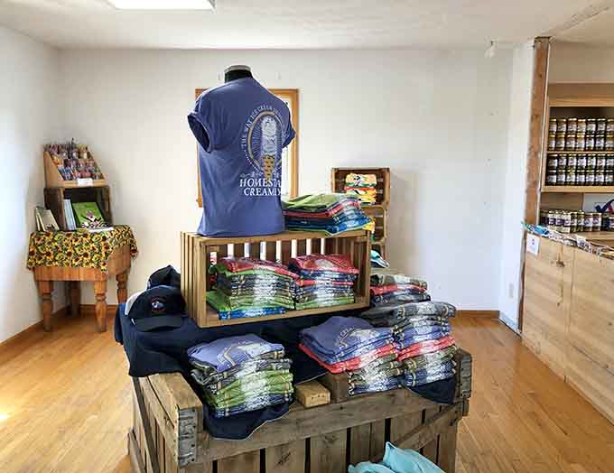 Folded neatly on wooden crates, these Homestead Creamery shirts are the souvenir that says you found something worth bragging about.