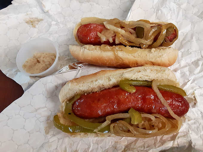 Two sausages loaded with peppers and onions, the kind of no-fuss, all-flavor situation that makes you smile.