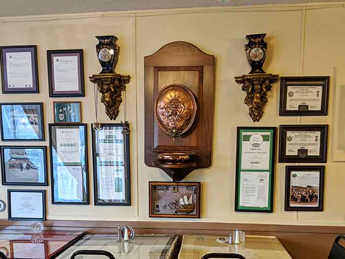 TripAdvisor certificates and framed awards line the wall, quiet proof that Julia's has been doing things right.
