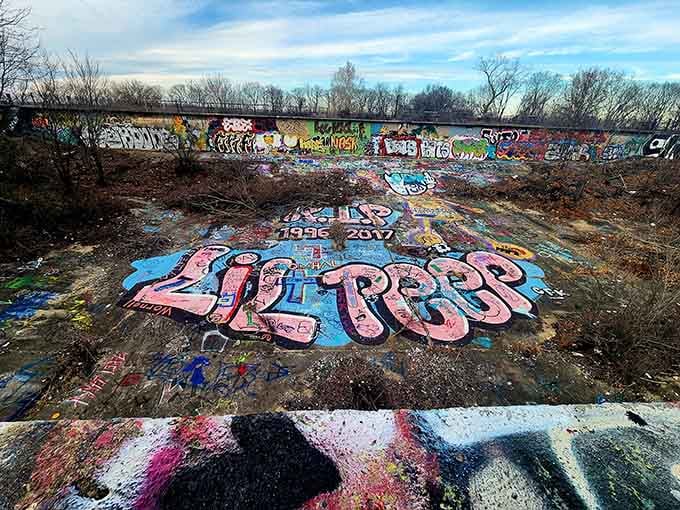 Bold letters and vibrant colors transform concrete into conversation, each piece layered over the last like urban archaeology.