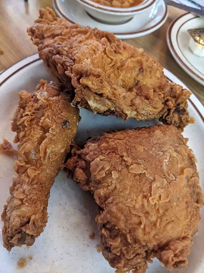 Fried buttermilk chicken with a crust so golden and crackling it practically announces itself before the plate even hits the table.