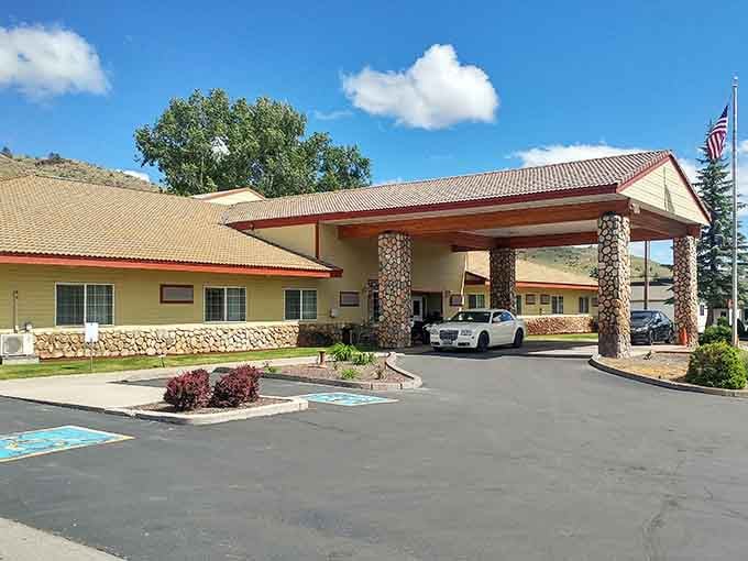 The Fremont Inn welcomes you with stone columns and a covered entrance that says you've arrived somewhere worth staying a while.