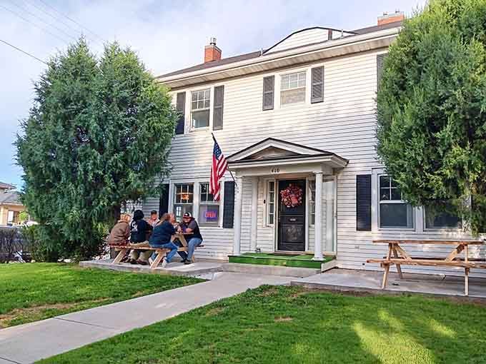 Neighbors gathered on the porch, cold drinks in hand, doing what small towns do best.