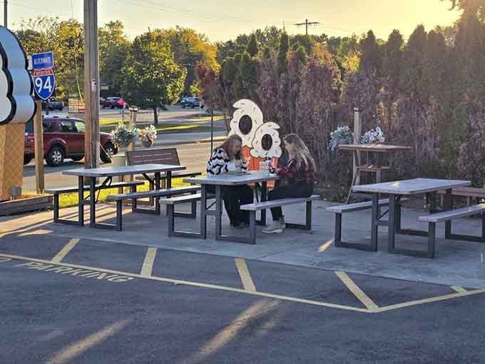 Two friends, one sunny evening, and a table full of ice cream. Lee's outdoor seating delivers the full experience.