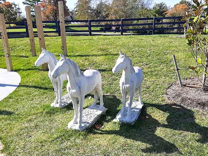White horse sculptures standing sentinel, adding artistic touches that honor Kentucky's equestrian heritage with quiet dignity.