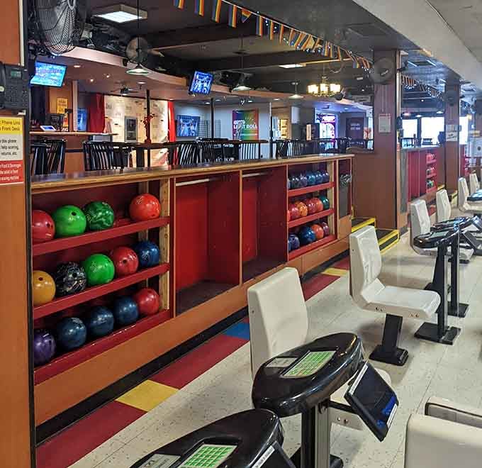 Colorful bowling balls line up like a rainbow of possibilities, each weight promising different results.