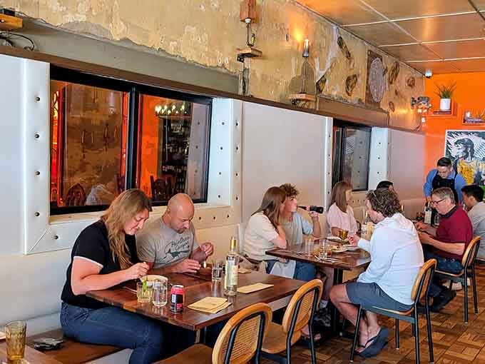 Real people enjoying real food in a real restaurant – no staged photos, just genuine dining happiness in progress.