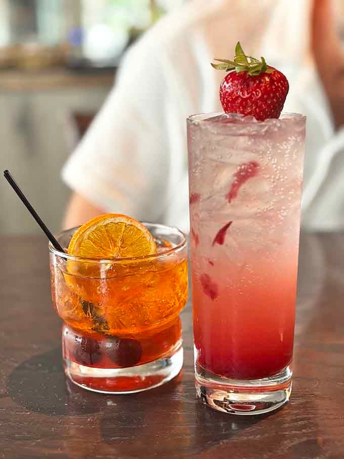 A classic old fashioned and a sparkling strawberry sipper, proof that great drinks deserve their own spotlight here.