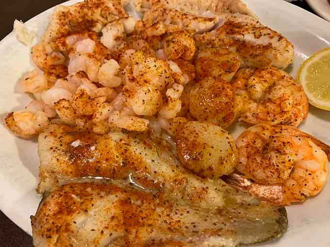 Broiled fish, scallops, and shrimp seasoned and plated with quiet confidence. Sometimes less fuss means more flavor.