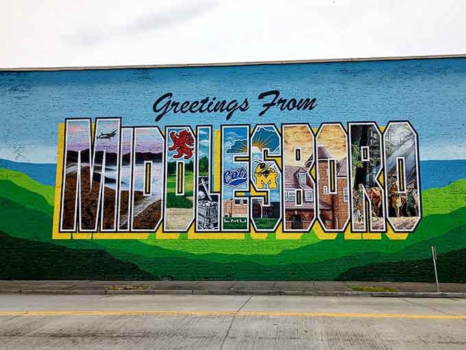 This "Greetings From Middlesboro" mural packs mountains, history, and local pride into one gloriously oversized postcard.