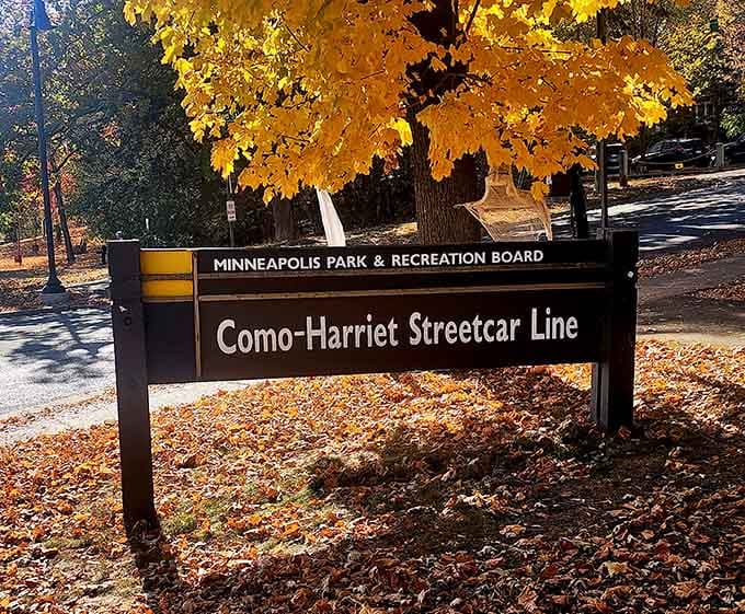 Fall foliage framing the Como-Harriet Streetcar Line sign is nature's way of saying, "Pay attention to this one."