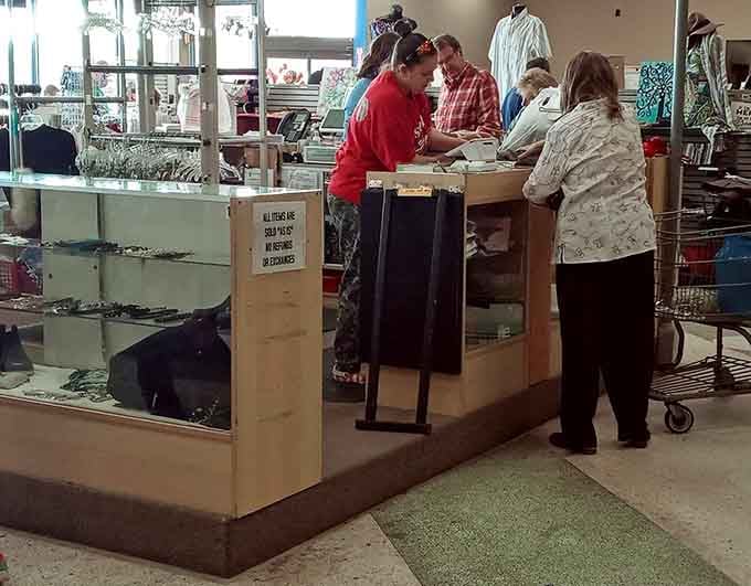 Friendly staff at the checkout counter, where every transaction feels like a small victory for your wallet.