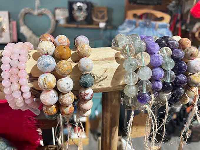 Stone bracelets in rose quartz, amethyst, and agate, lined up like a very stylish geology lesson you actually want to attend.