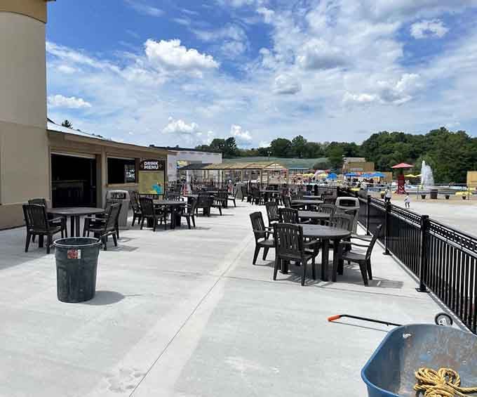 An open-air dining terrace with a view of the park, because eating lunch while watching chaos unfold is genuinely satisfying.
