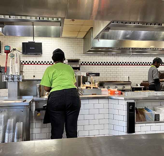 The kitchen at Nathan's moves with quiet confidence, the kind that only comes from doing something really well for a very long time.