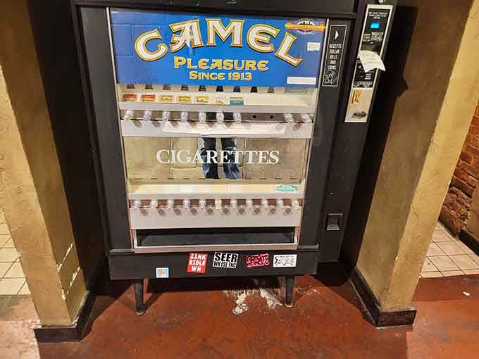 A vintage cigarette machine standing in the corner, quietly reminding you that this place has genuine character and history.