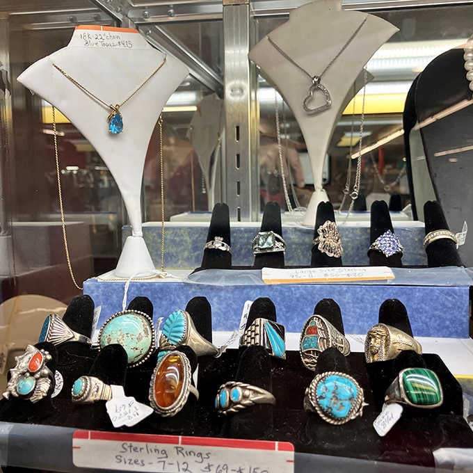 Sterling silver rings with turquoise, coral, and malachite, the kind of jewelry that looks like it belongs in a museum and on your finger.