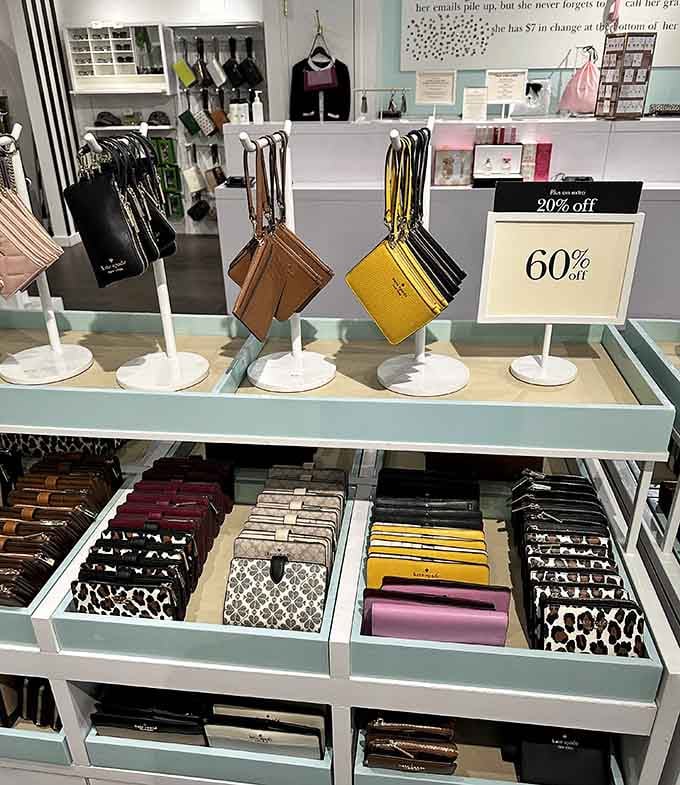 Kate Spade wallets lined up in every color imaginable. Sixty percent off signs have never looked so beautiful.