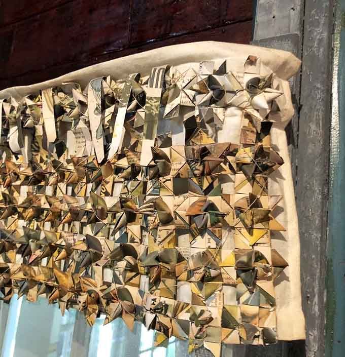 Window curtains folded entirely from newspaper pages. Functional, creative, and somehow the most charming window treatment you've ever seen.