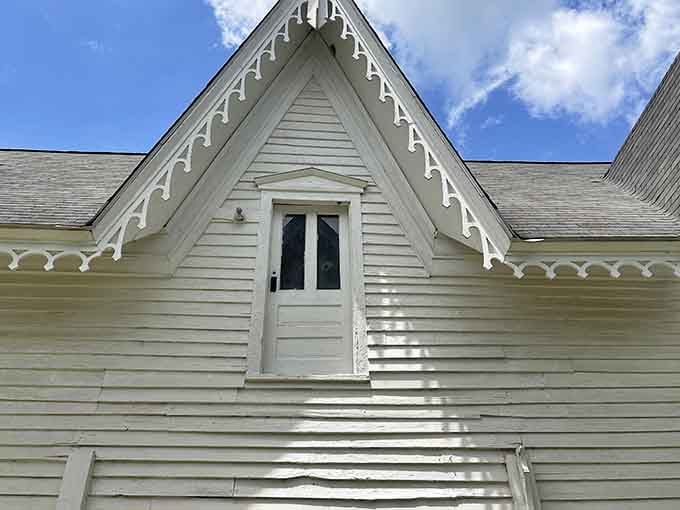 A second-floor door that opens onto nothing but air, which is either an architectural quirk or a very bold statement.