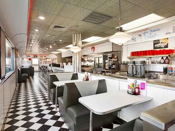 Counter seating, pendant lights, and vintage signs covering every wall. This diner has personality to spare.