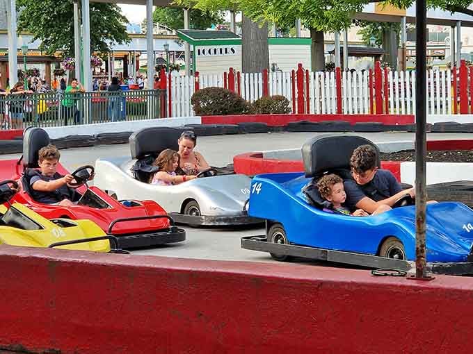 Go-karts bring out the competitive spirit in everyone, including the adults who are definitely not taking this more seriously than the kids.