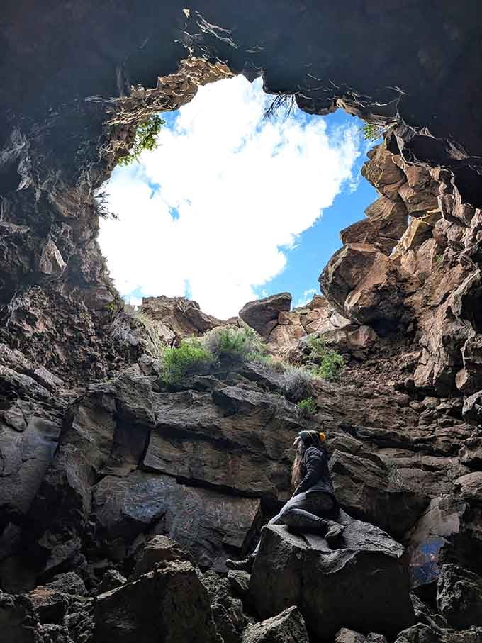 Looking up from inside the cave, the sky becomes a perfectly framed masterpiece of blue and clouds.