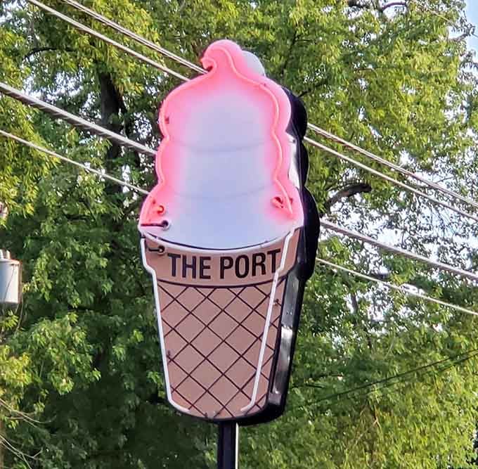 That glowing ice cream cone sign at dusk is basically a lighthouse for hungry travelers passing through Chesterton.