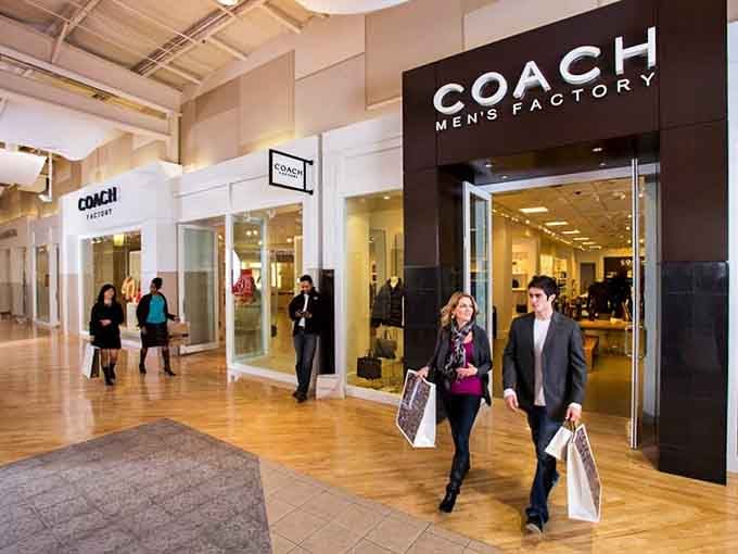 Coach Men's Factory where polished shoppers emerge looking like they just closed a Fortune 500 deal.